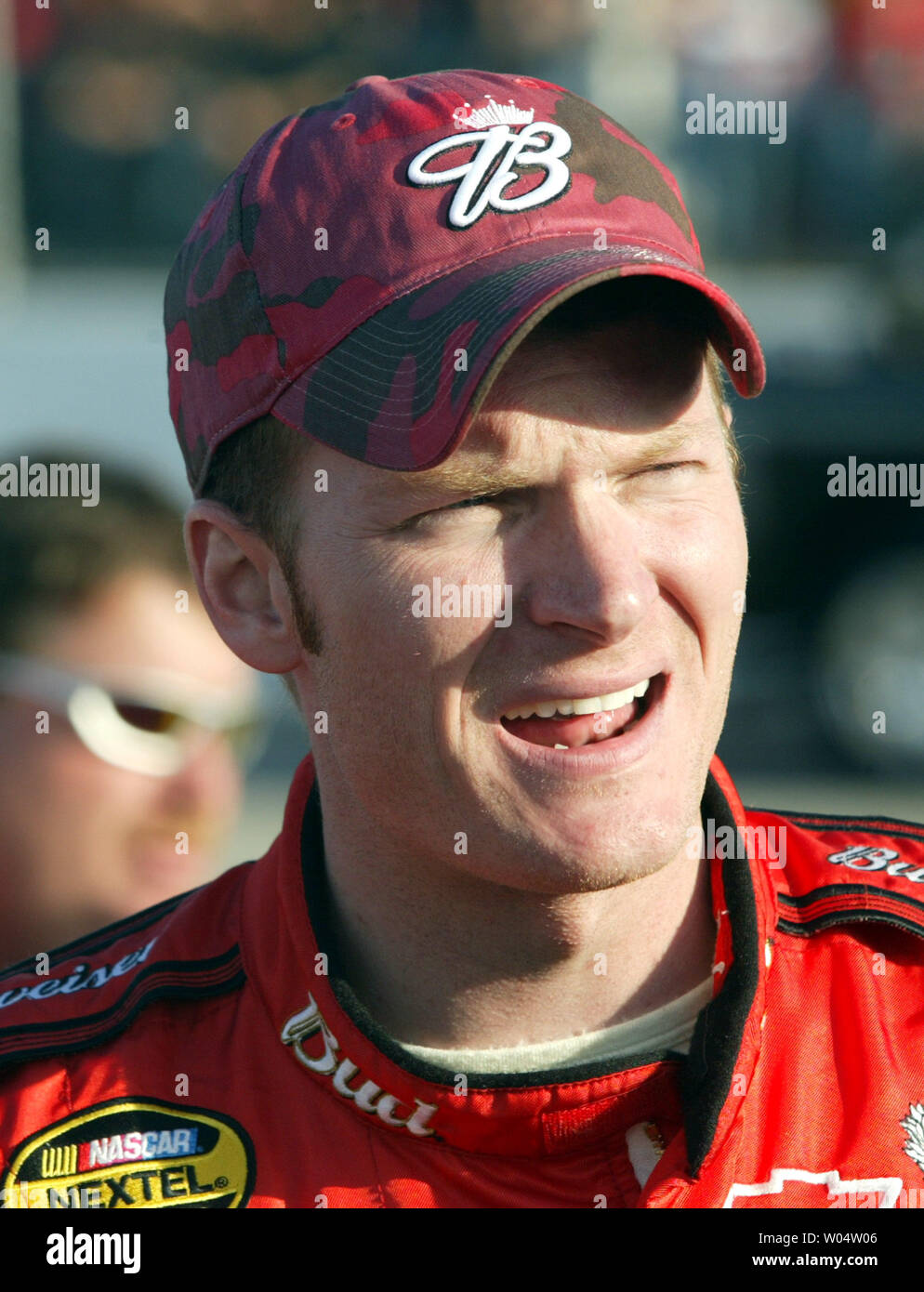 Race car driver Dale Earnhardt, Jr. talks on pit road as he awaits the ...
