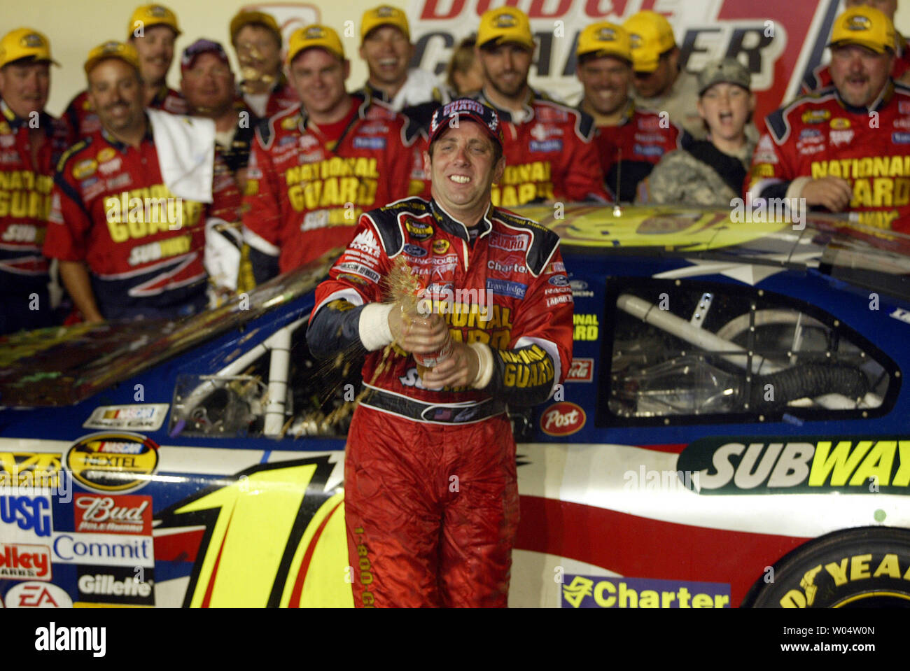 Greg Biffle sprays a soft drink as he celebrates winning the NASCAR ...