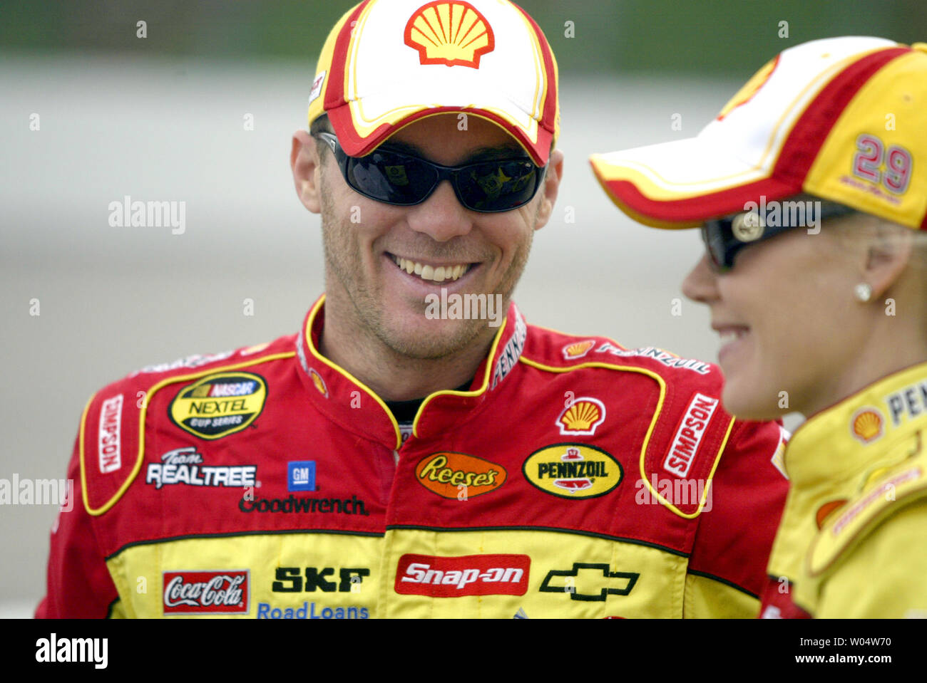 Race car driver Kevin Harvick, left, laughs with his wife Delana ...