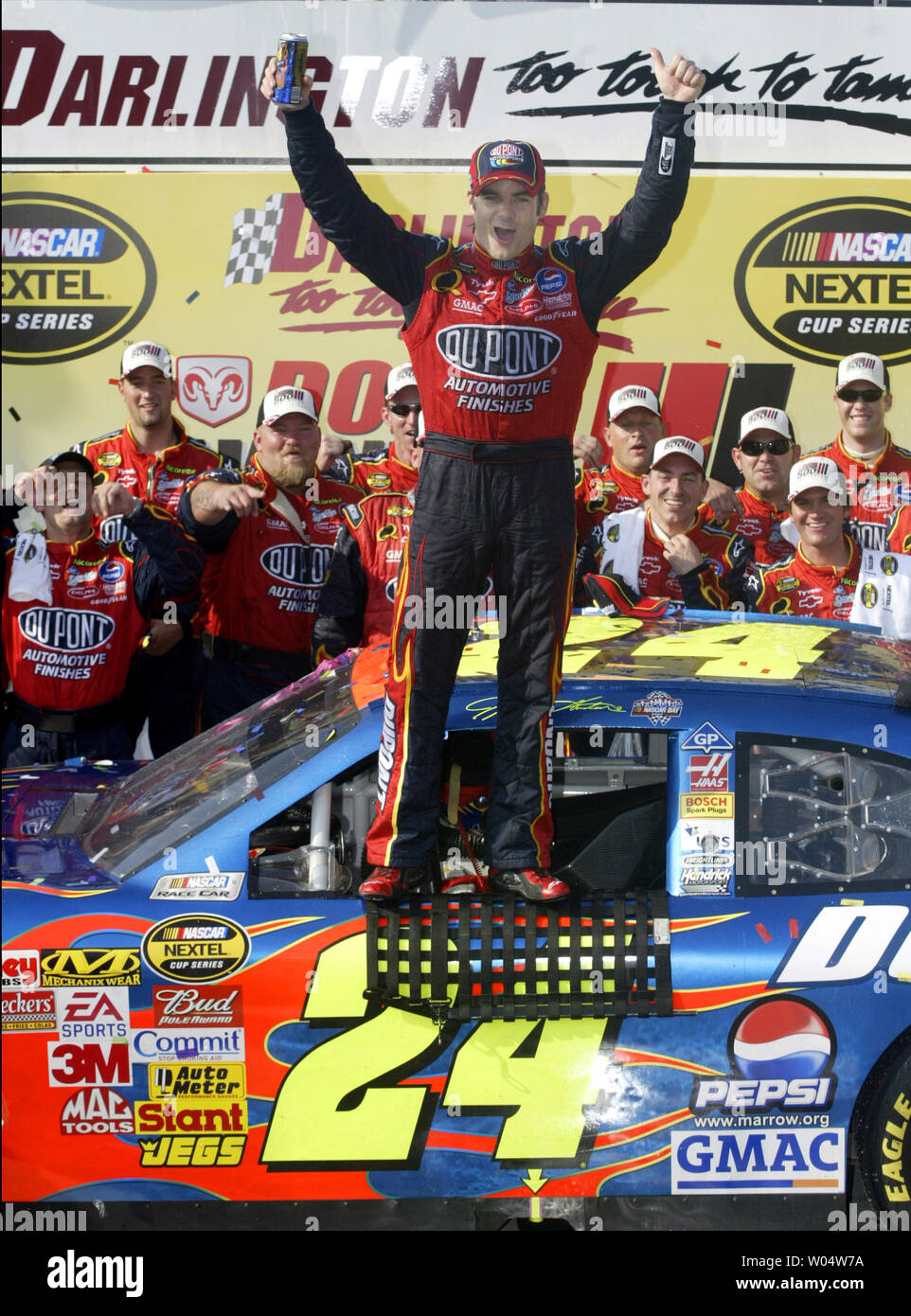 Jeff Gordon celebrates in victory lane after winning the Dodge Avenger ...