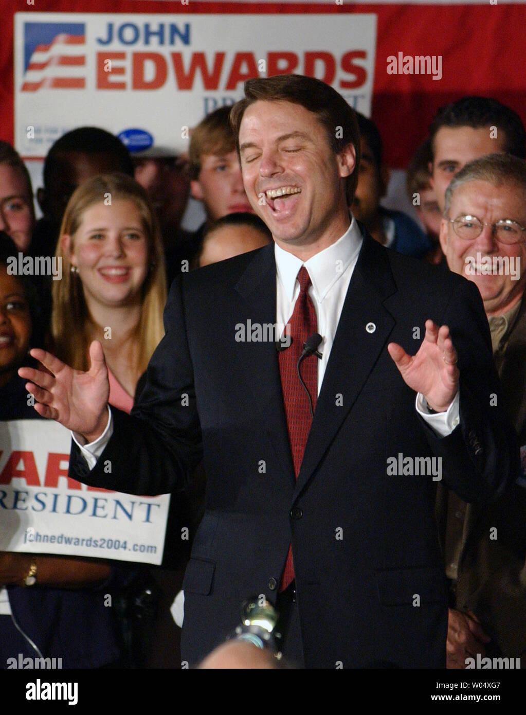 A happy Senator John Edwards is flanked by his family, wife Elizabeth ...