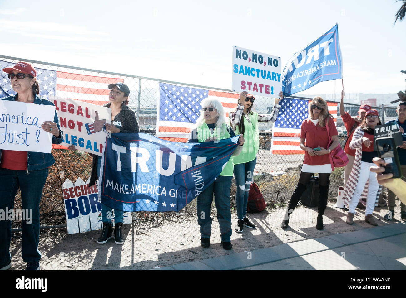 Demonstrators attend an "America First" rally at the San Ysidro Port of ...