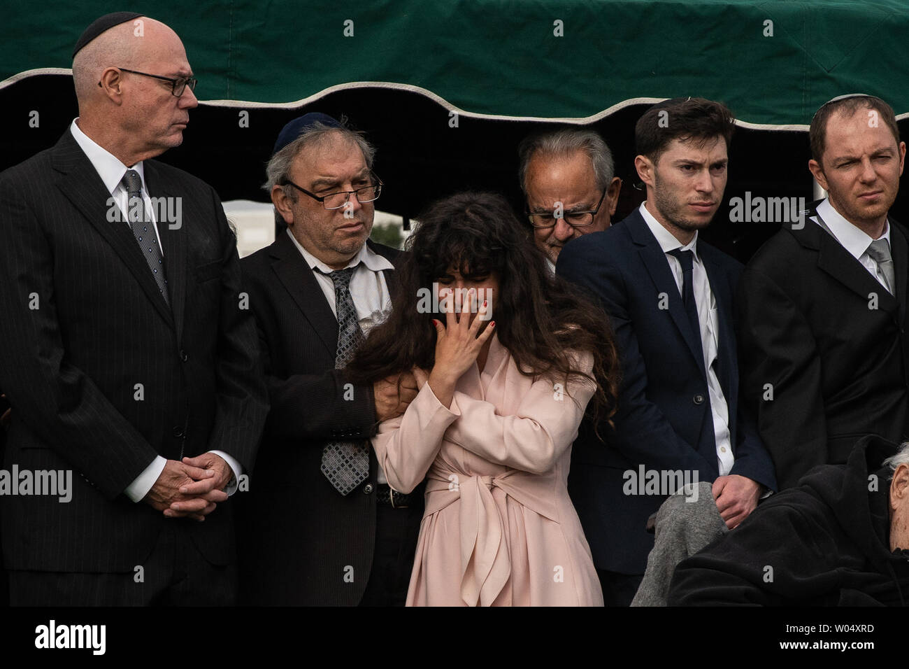 Members of the Kaye family, daughter Hannah (center) and her father ...
