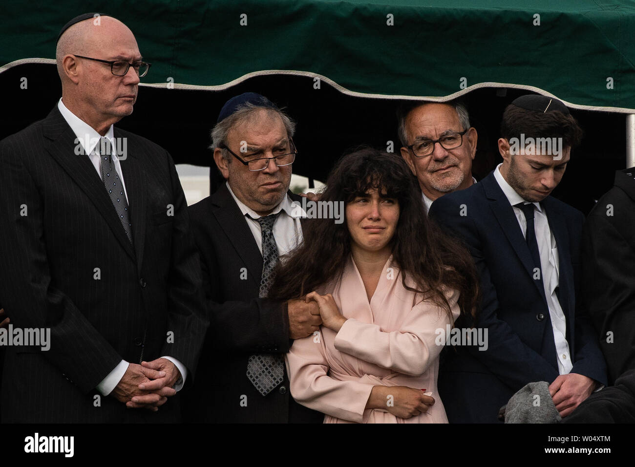 Members of the Kaye family, daughter Hannah (center) and her father ...