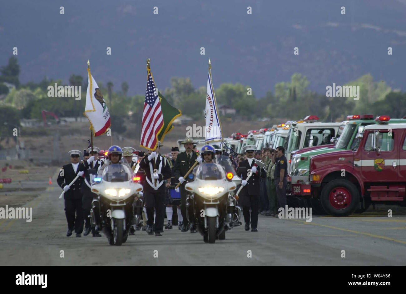 Firefighters stand at attention as a memorial procession for Novato ...