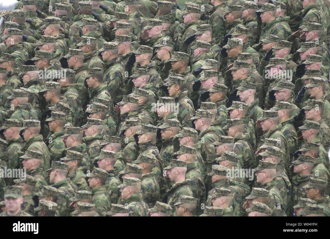 Marines salute the colors as they wait the arrival of President George ...