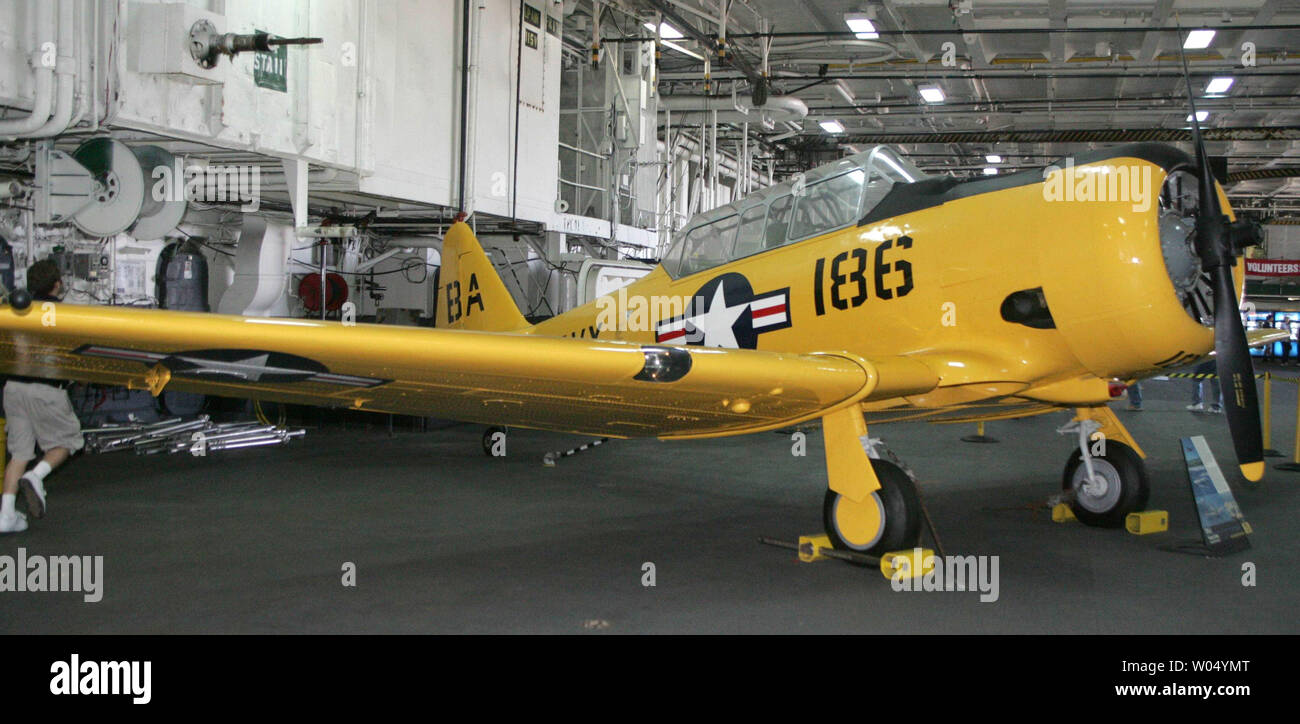 A SNJ Primary Trainer is displayed on the USS Midway's Hangar Deck on ...