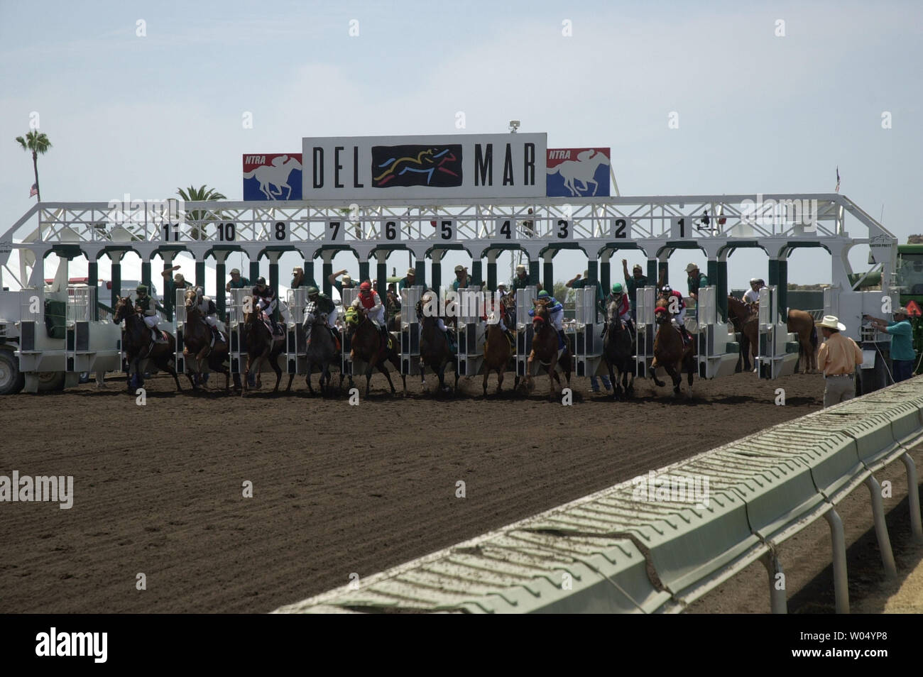 Horses come out of the starting gates hi-res stock photography and ...
