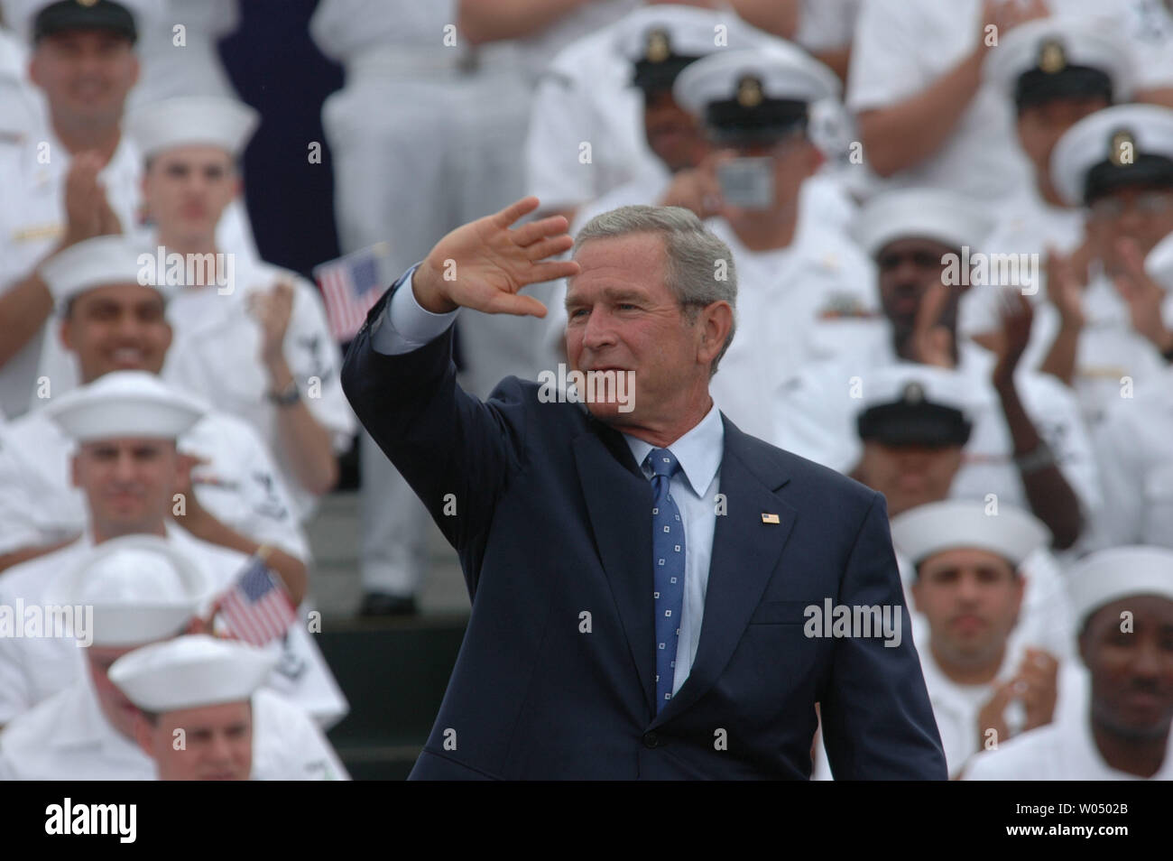 U.S. President George W. Bush waves to crowd of Naval personal after ...