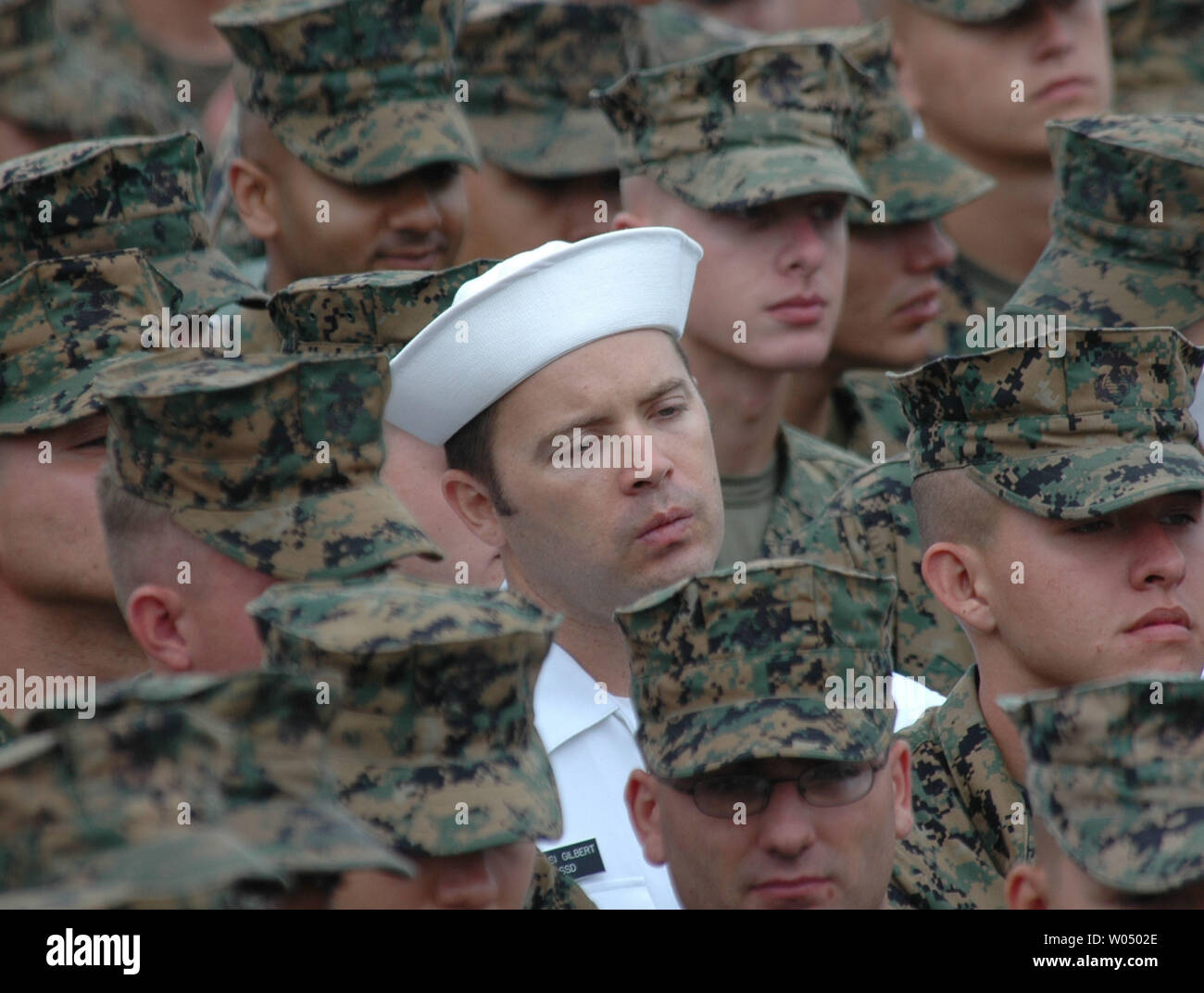 A sailor stands in a sea of Marines and listens as U.S. President ...