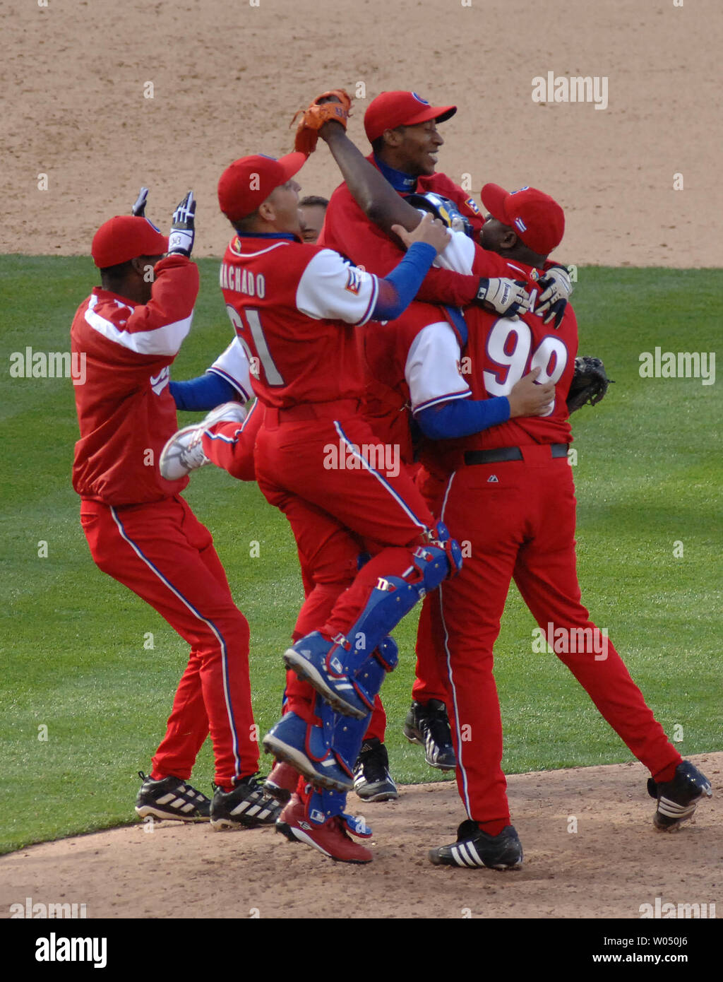 Cuban players celebrate following their 3-1 victory over the Dominican ...