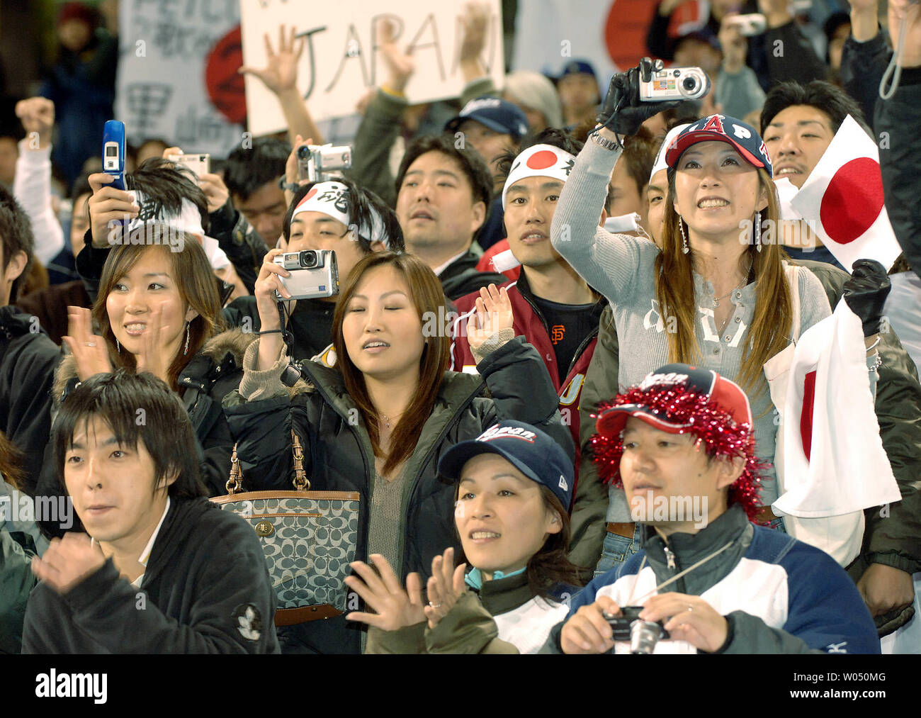 Japanese fans celebrate after their team's 10-6 win over Cuba to win ...