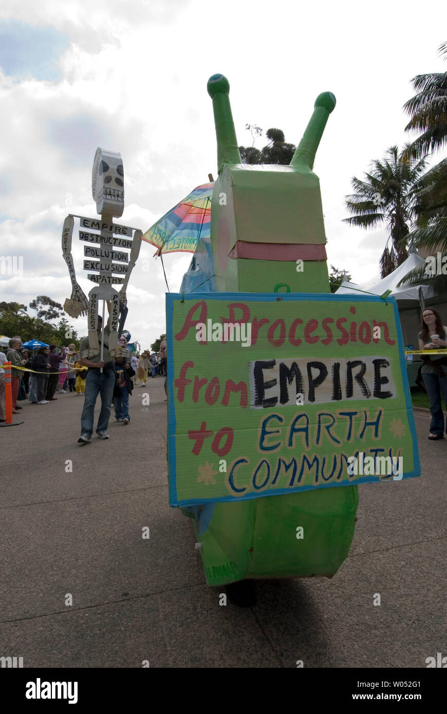 A parade featuring puppets, dancers, drummers and electric vehicles ...