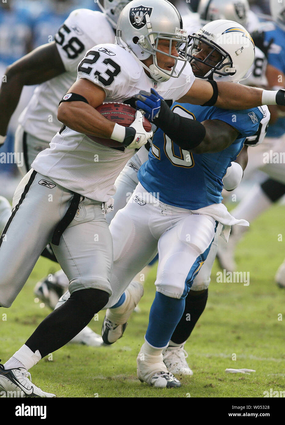 Oakland Raiders corner back Chris Carr runs the ball past San Diego ...
