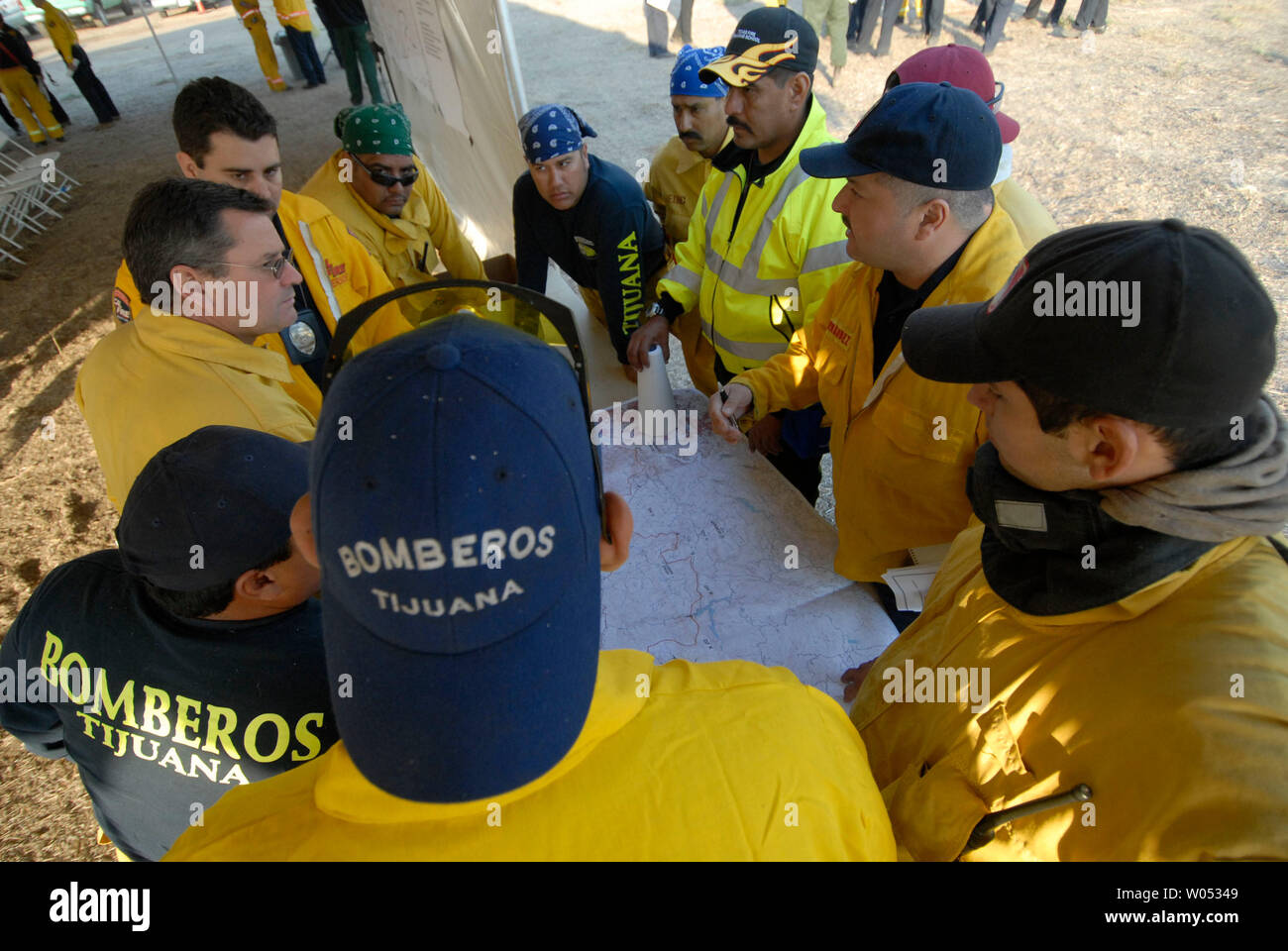 A group of Mexican firefighter, called "Bomberos" from Tijuana talk ...