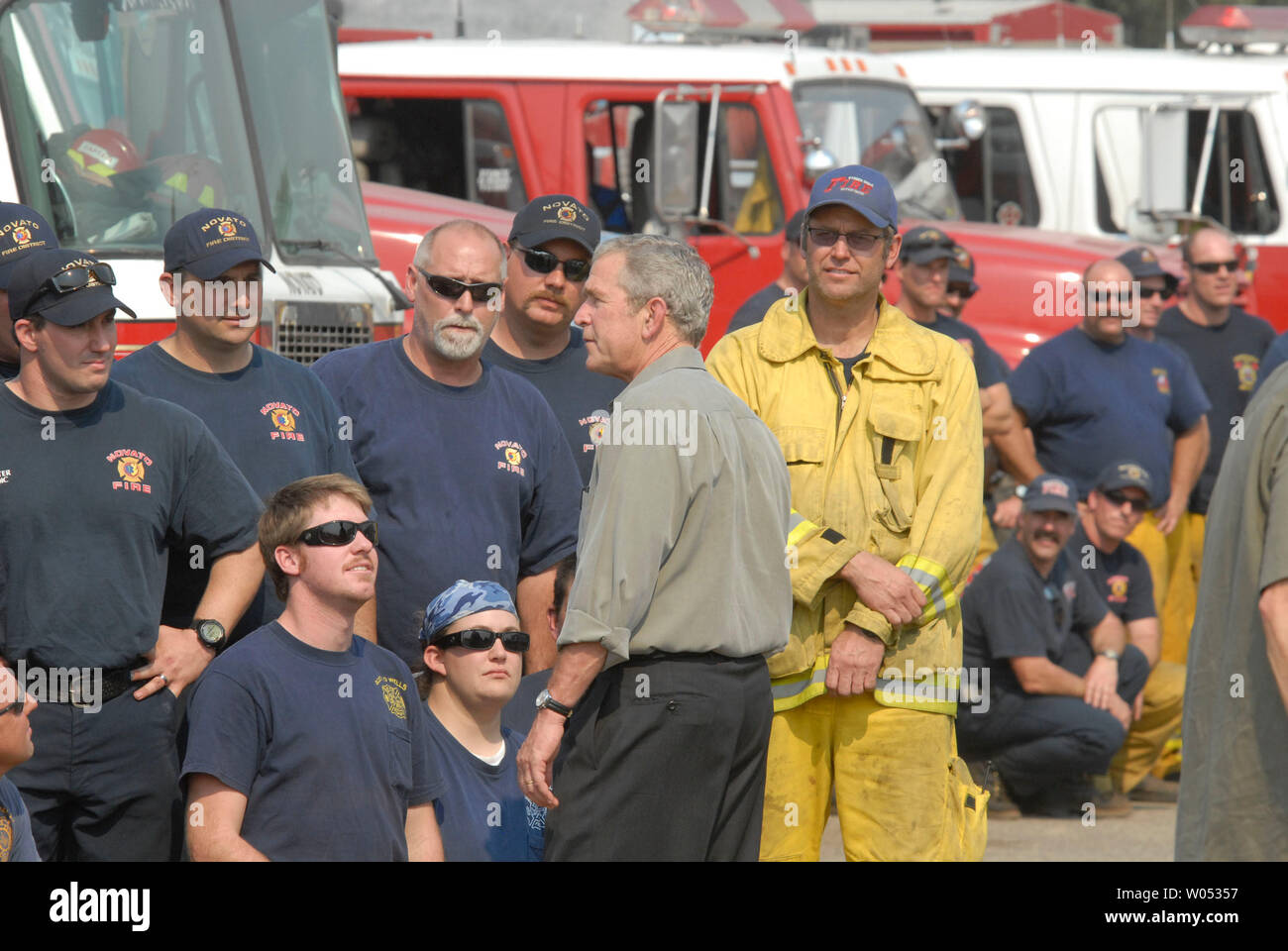 U.S. President George W. Bush greets firefighters at Kit Carson Park in ...
