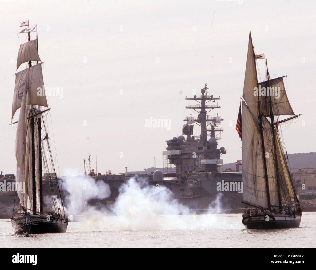 Americas Privateer Lynx (L) fires its cannons in a mock gun battle with ...