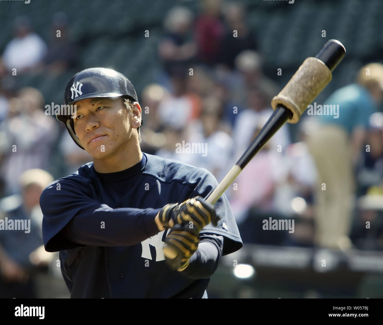 New York Yankees' outfielder Hideki Matsui warms up before their game ...