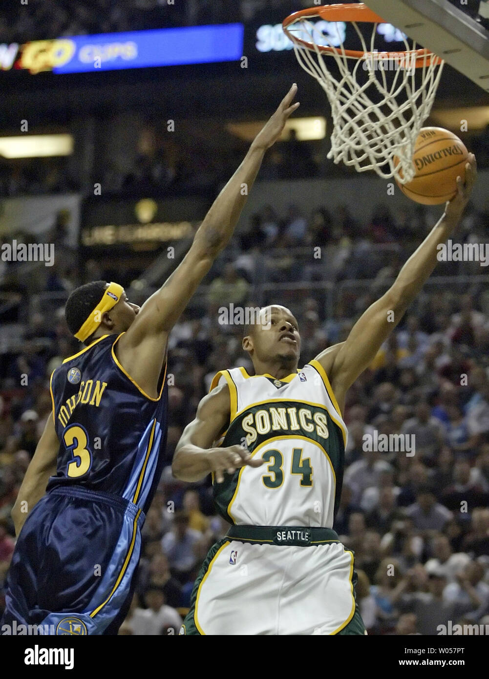 Seattle Supersonics' Ray Allen, right, goes up for a layup against ...
