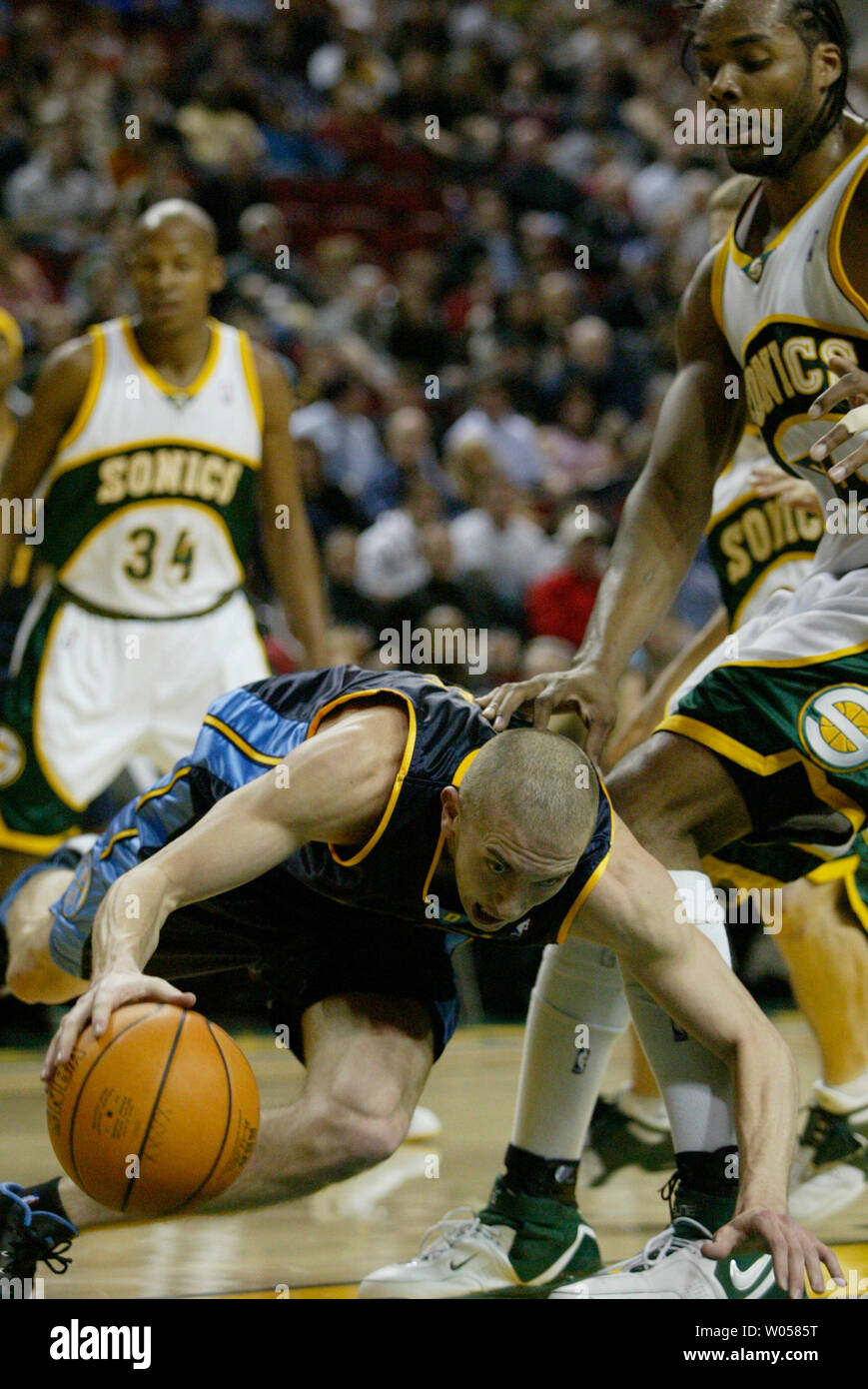 Denver Nuggets' Steve Blake, left, is pushed to the floor by Seattle ...