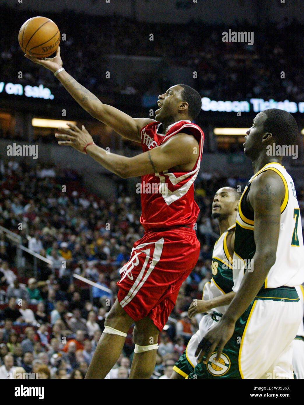 Houston Rockets' Tracy McGrady goes to the basket past Seattle ...