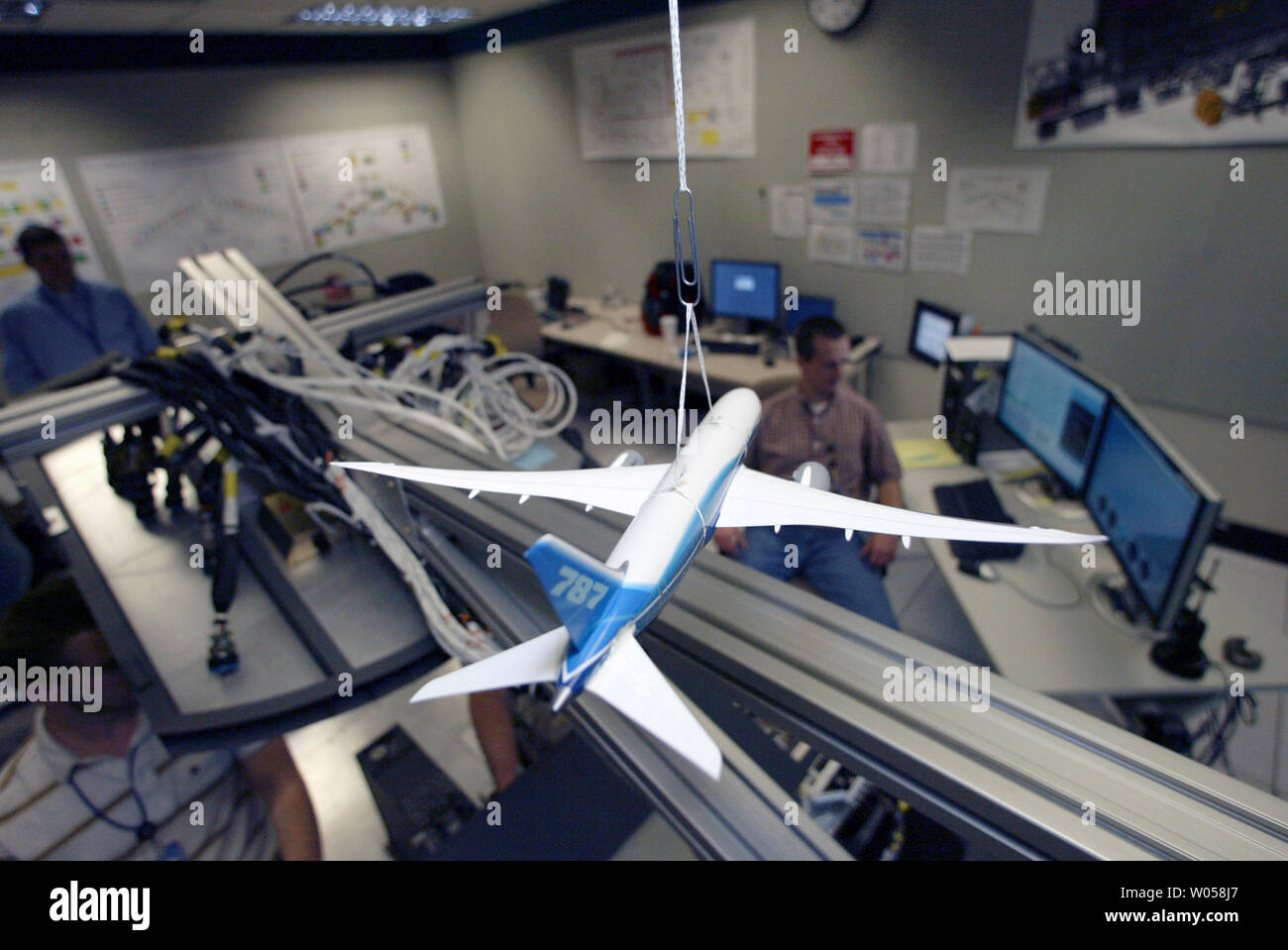 A model of the Dreamliner 787 hangs above Flight Control Engineers as ...