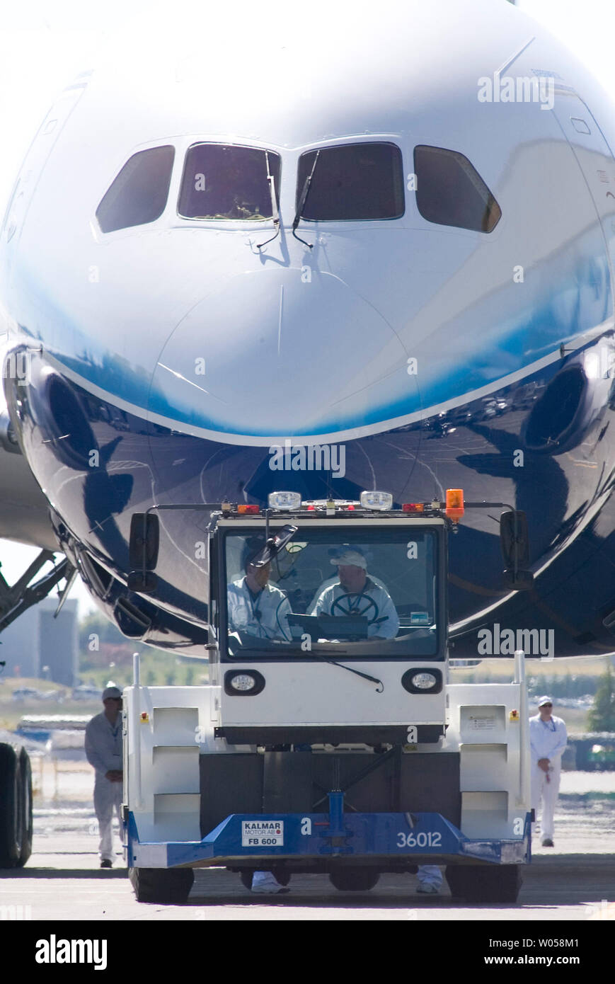 Boeing's employees pull the new 787 Dreamliner as it was unveiled at ...