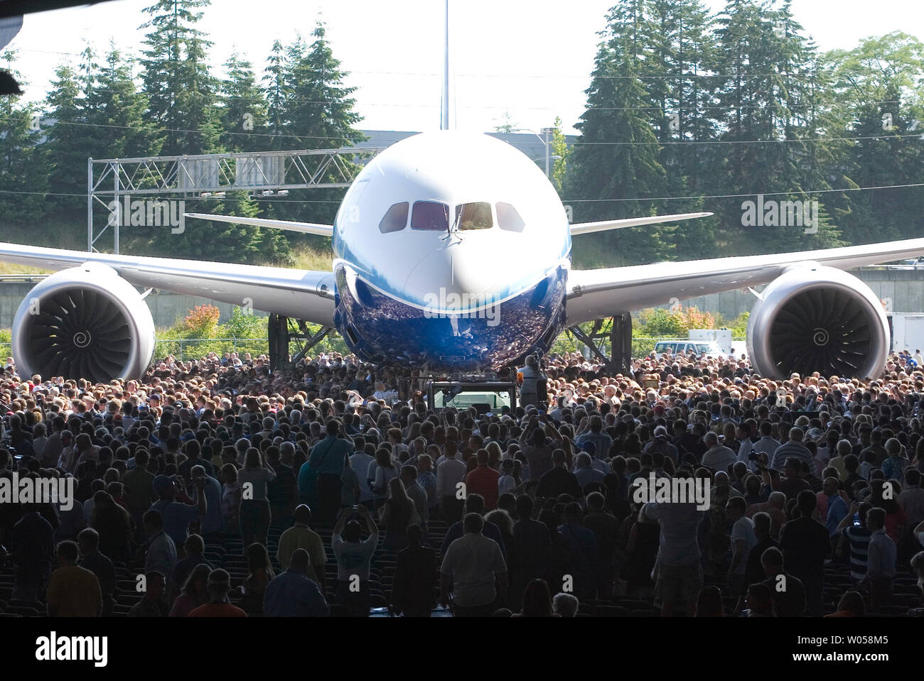 Boeing employees surround the new 787 Dreamliner after it was unveiled ...