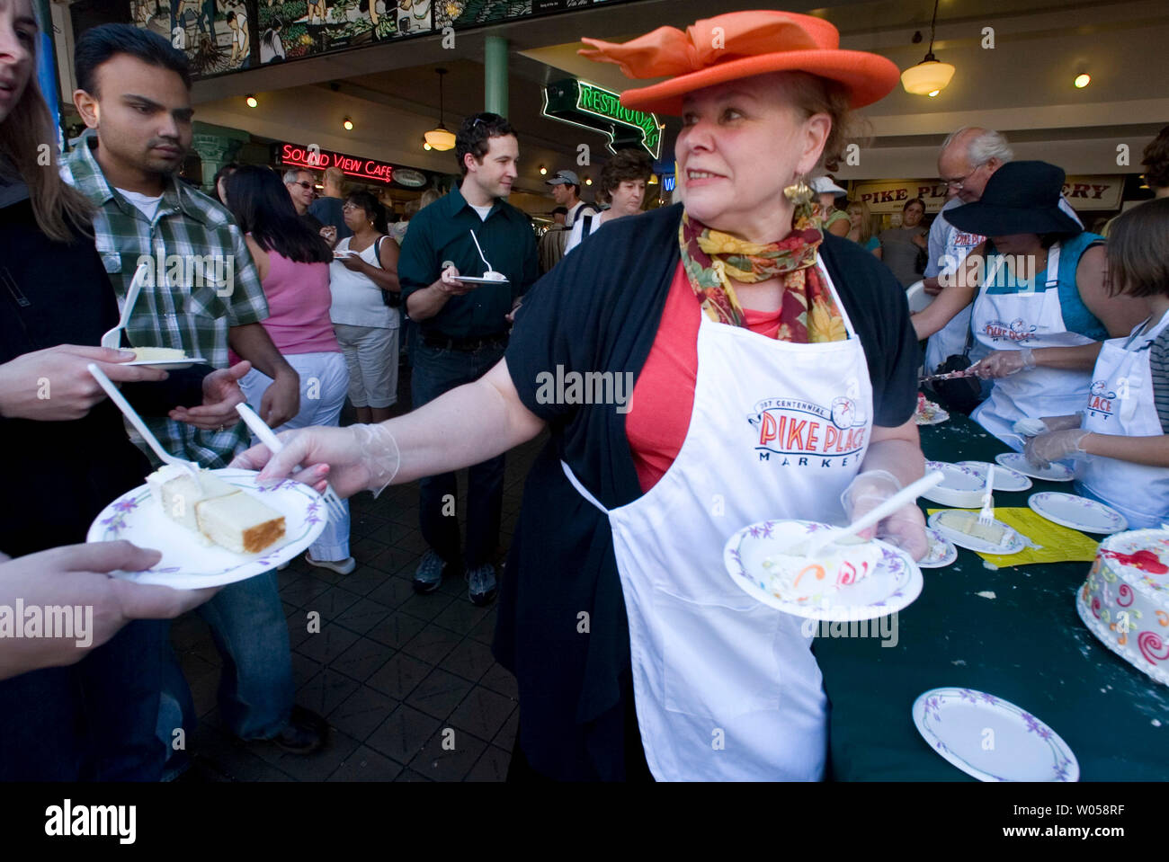 Claudia Kelly dishes out birthday cake to passers-by attending the ...