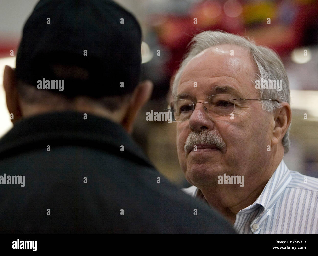 Costco co-founder Jim Sinegal (R) listens to Robert Evans while ...
