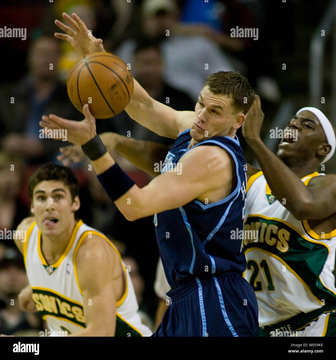 Utah Jazz' Matt Harpring (C) loses the ball while being guarded by ...