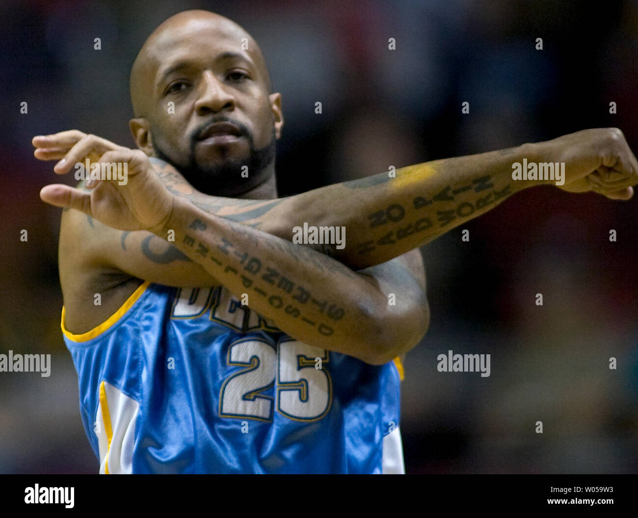 Denver Nuggets' Anthony Carter stretches before a game against the ...