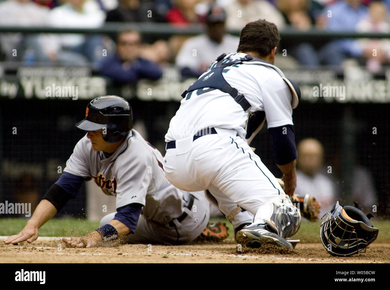 Detroit Tigers Brandon Inge slides past Seattle Mariners catcher Jamie ...