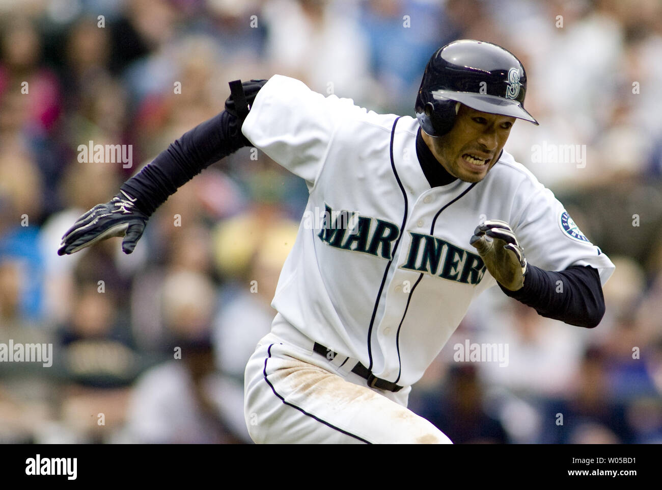 Seattle Mariners right fielder Ichiro Suzuki, of Japan, runs to first ...