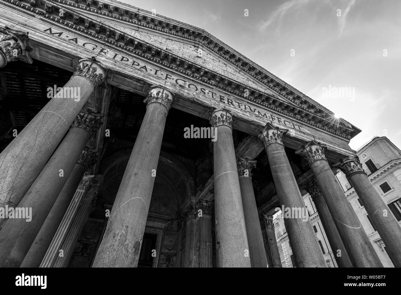 Pillars supporting the entire building. Strong columns. Black and white ...
