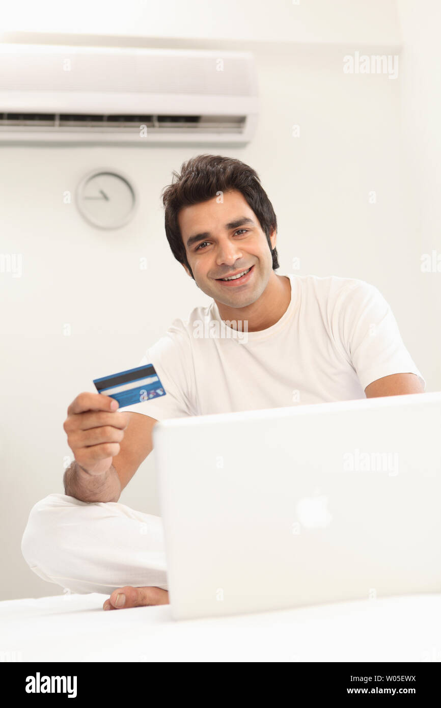 Indian man doing online shopping Stock Photo - Alamy