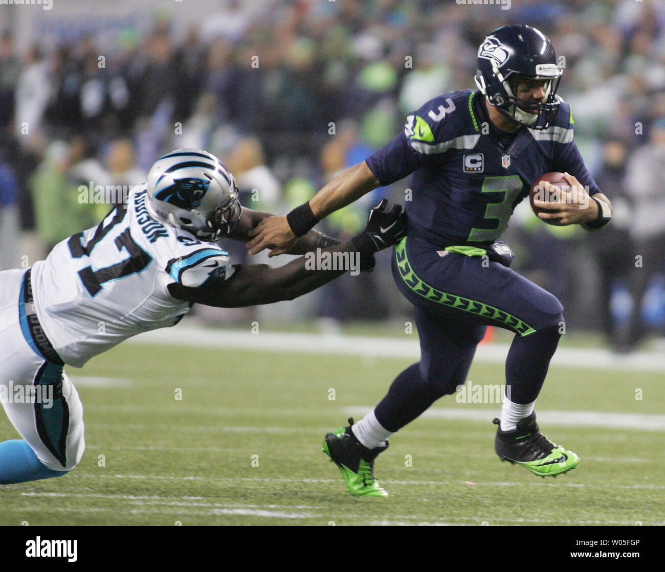 Seattle Seahawks quarterback Russell Wilson (3) scrambles away from ...
