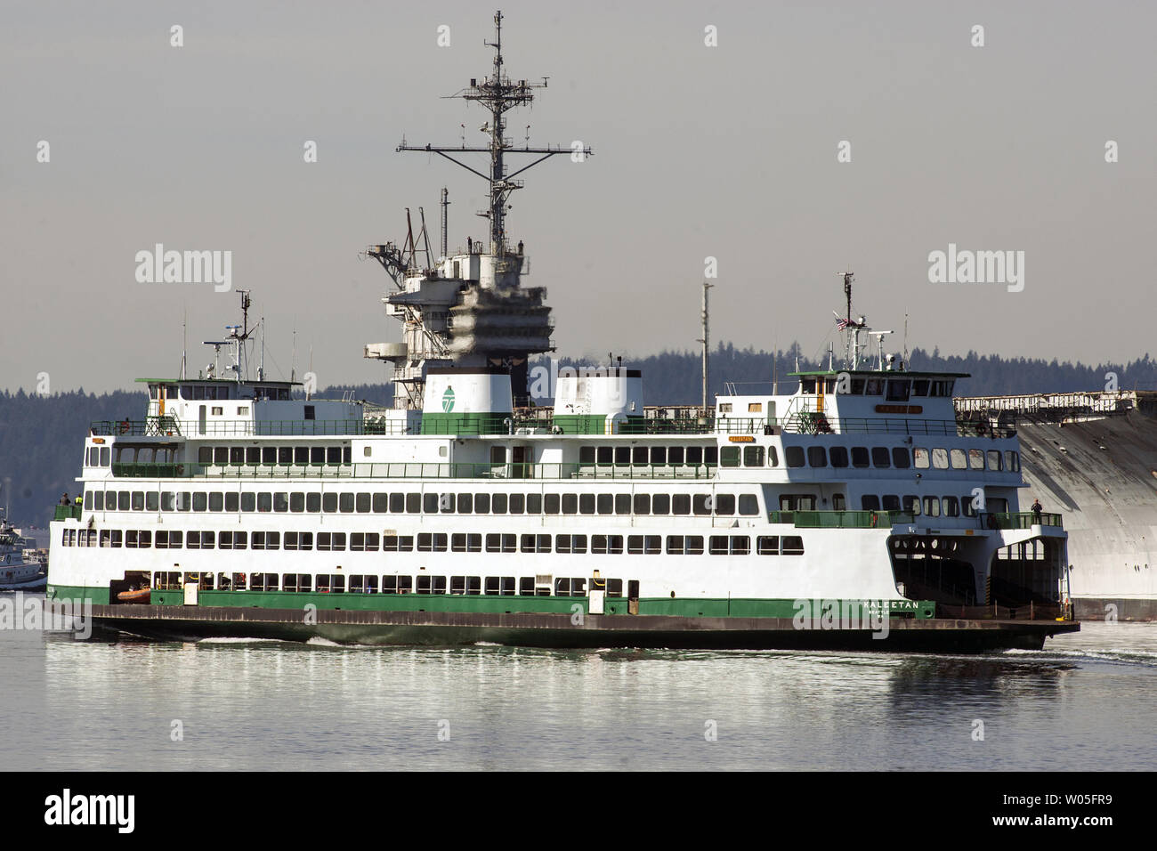 The Washington State Ferry, Kaleetam, passes the USS Ranger as it's ...