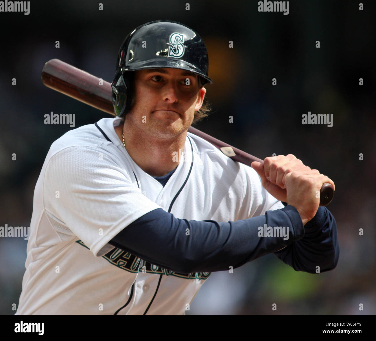 Seattle Mariners' Brad Miller looks back at home plate umpire Larry ...