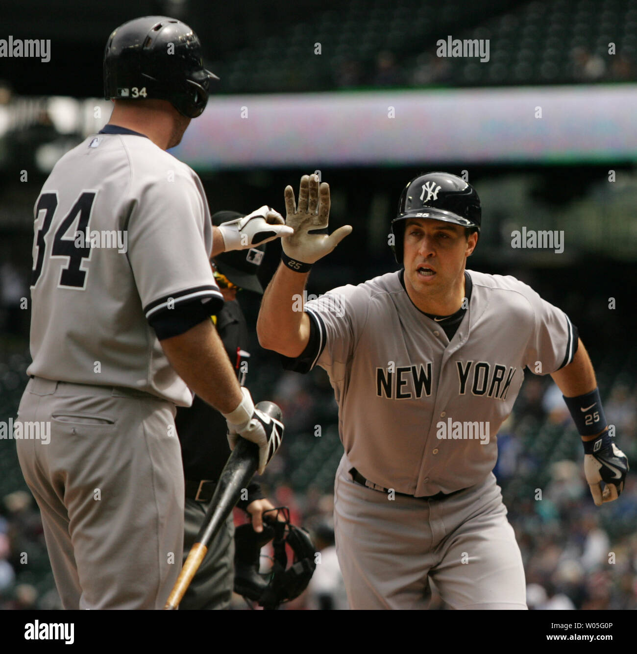 New York Yankees Mark Teixeira, right, celebrates his second inning ...