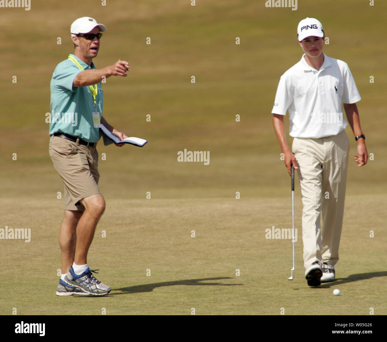 15-year-old Cole Hammer, from Houston, right, receives some points from ...