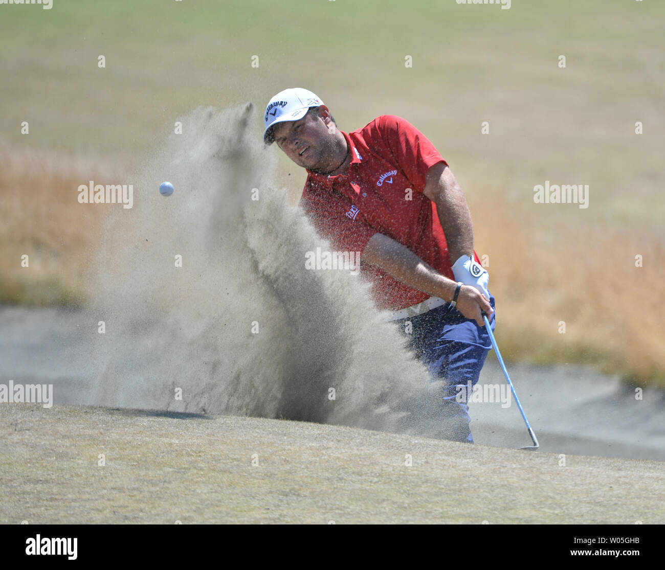 Patrick Reed hits out of a bunker on the second hole during the third ...