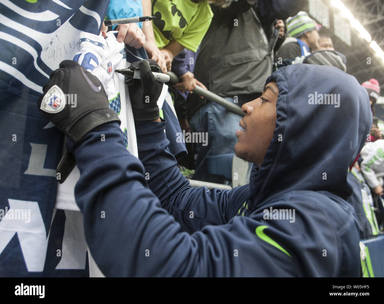 Seattle Seahawks wide receiver Tyler Lockett signs autographs before ...