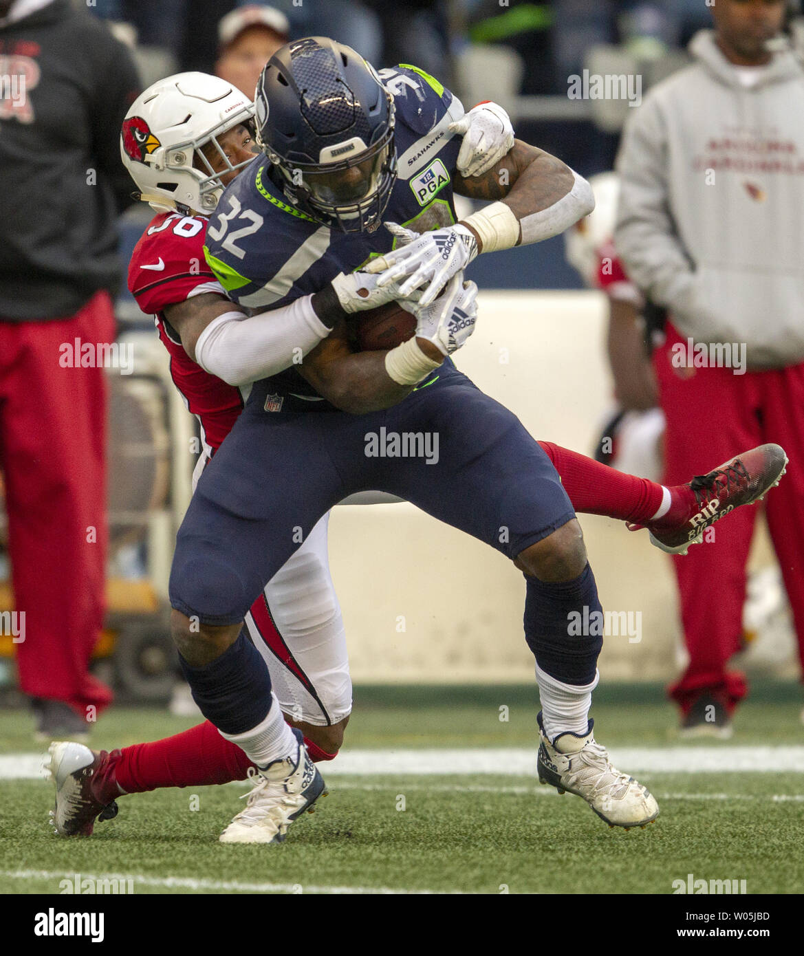 Seattle Seahawks running back Chris Carson (32) is run down by Arizona ...