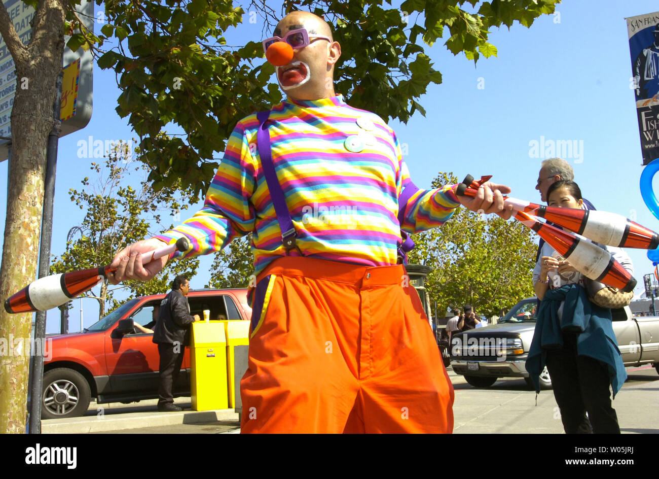Kenneth Kahn, aka "Kenny the Clown," does his bit on Fisherman's Wharf ...