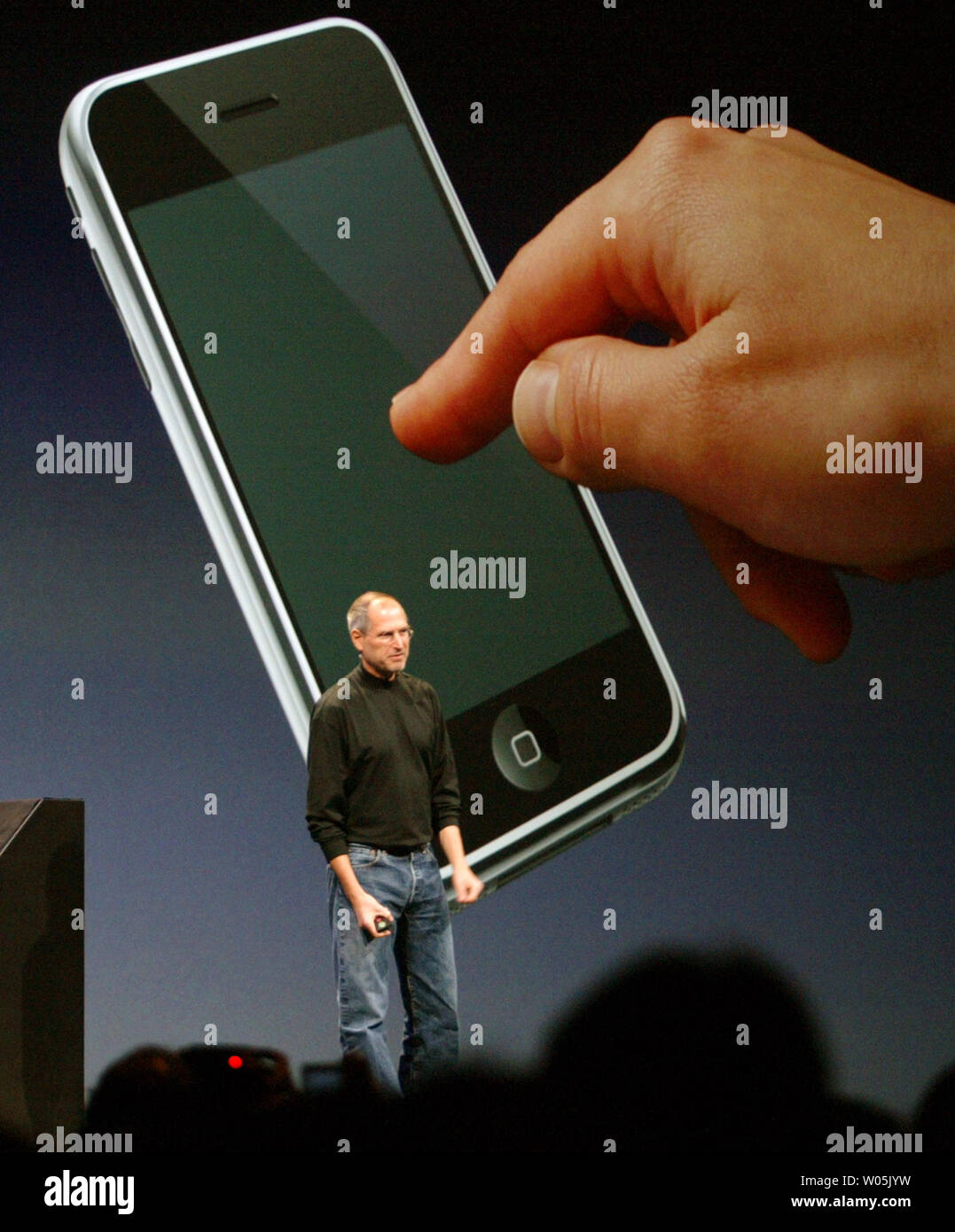 Steve Jobs, CEO of Apple Inc., unveils the new iPhone, while giving the ...