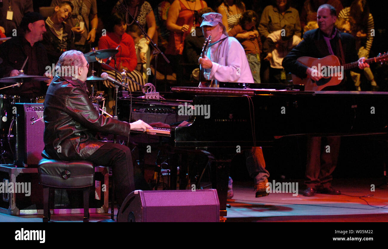 Neil Young (right) performs with Jerry Lee Lewis (L) during the 21st ...