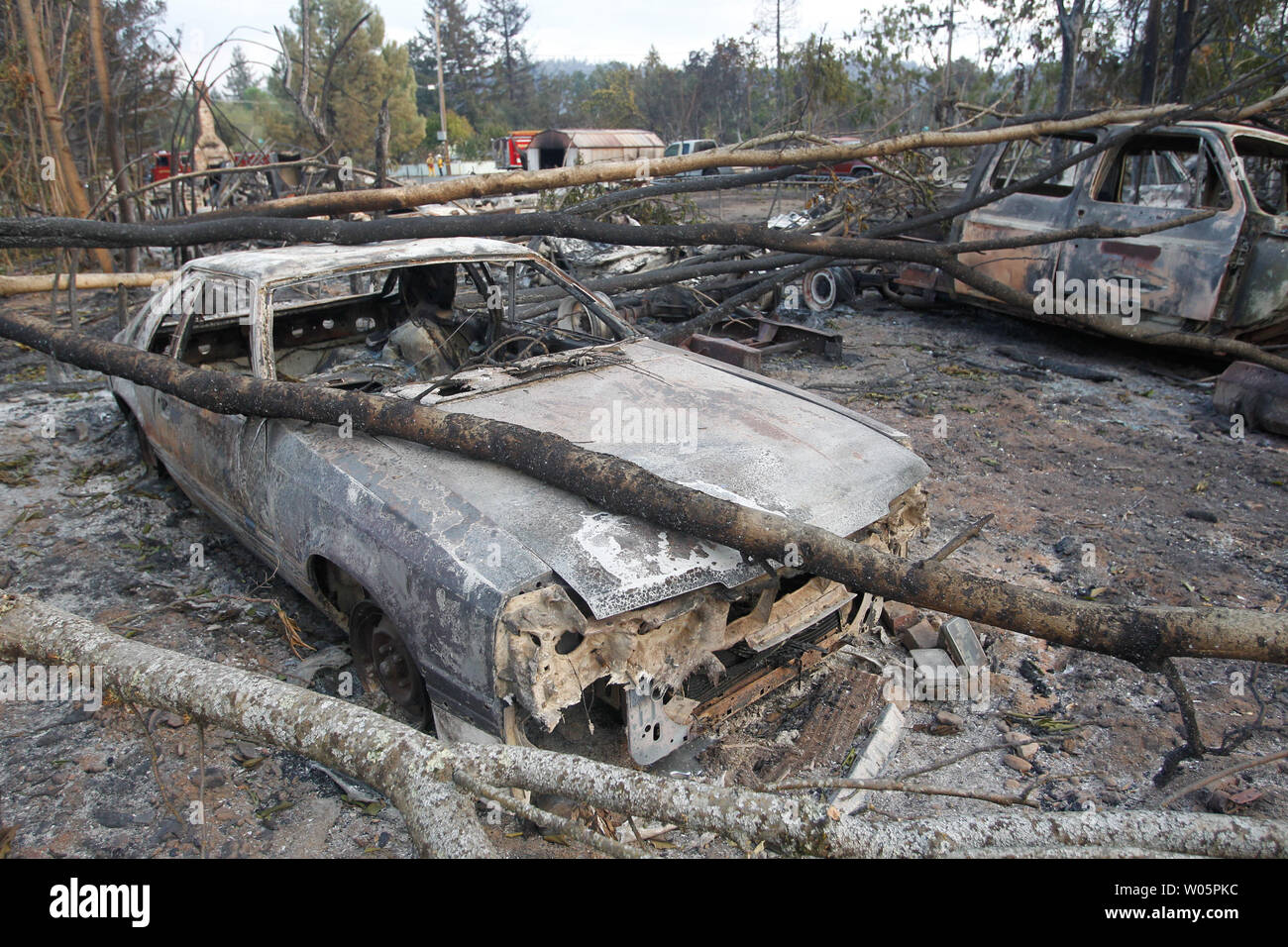 The burned remains of houses and vehicles sit destroyed by the Valley ...