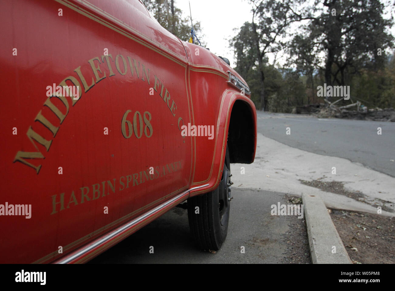 An old fire engine sits untouched by fire at Harbin Hot Springs after ...