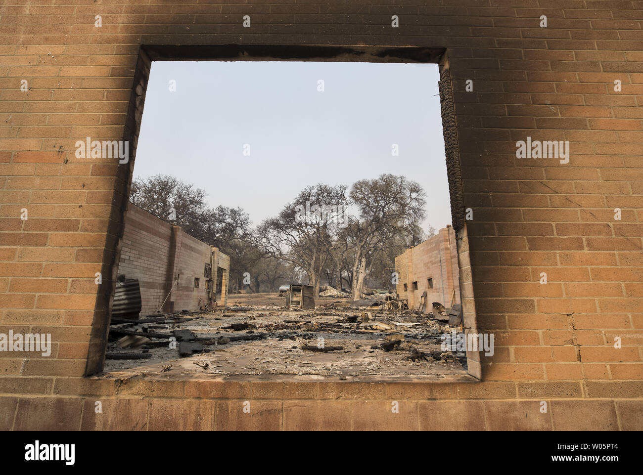 The view through a charred window of an industrial building that was ...